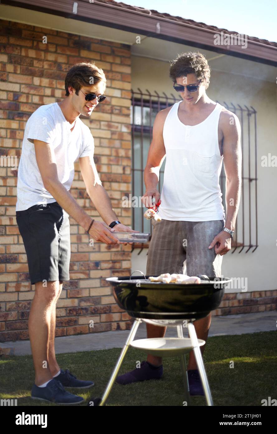 Men, grill and meat season for BBQ in the backyard with cooking and ...