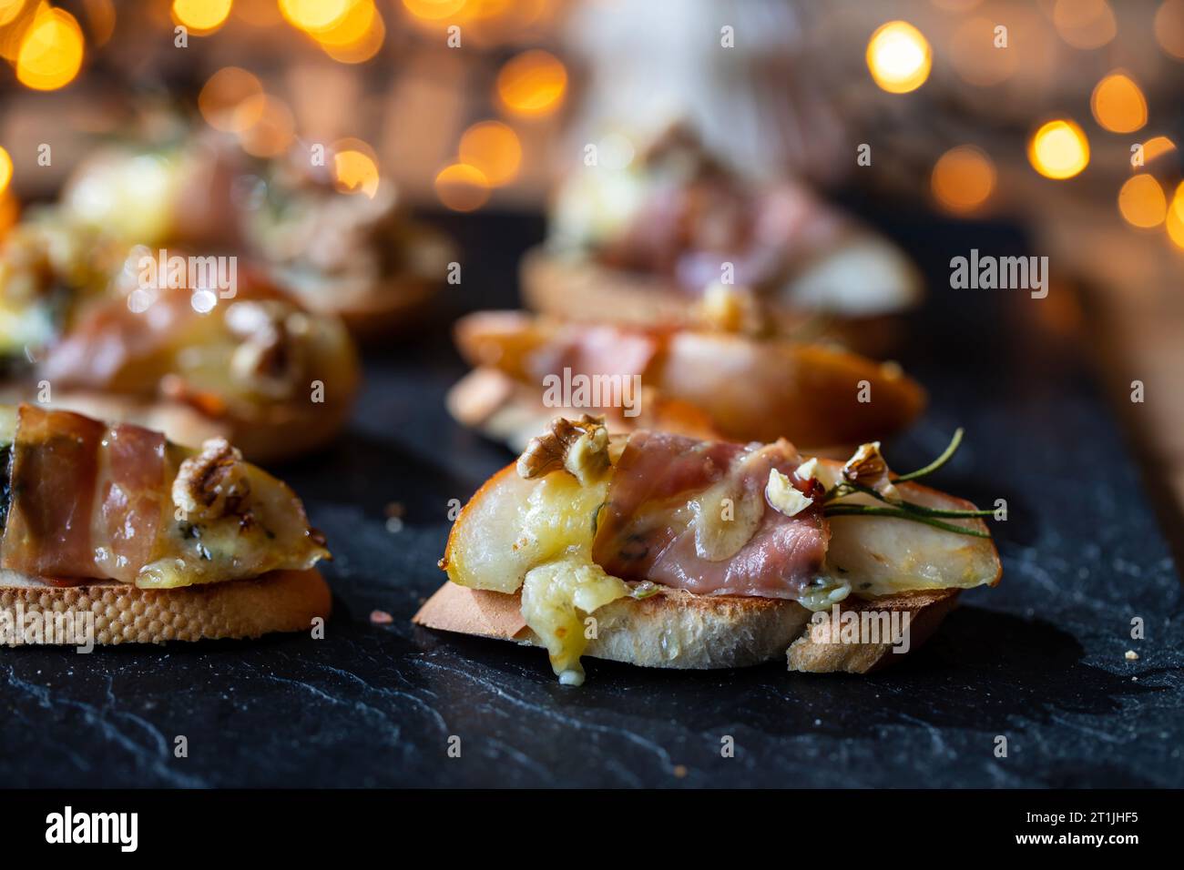 Christmas canapes made of pears, blue cheese and Parma ham Stock Photo ...