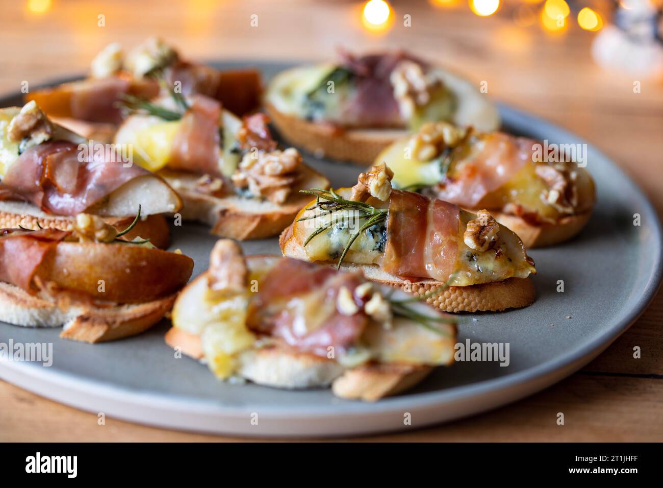 Christmas canapes made of pears, blue cheese and Parma ham Stock Photo ...