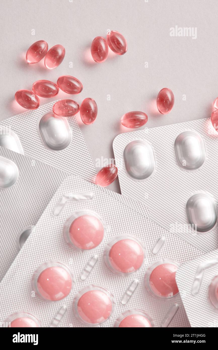 Vertical template with medical pills, tablets packages and pink ...