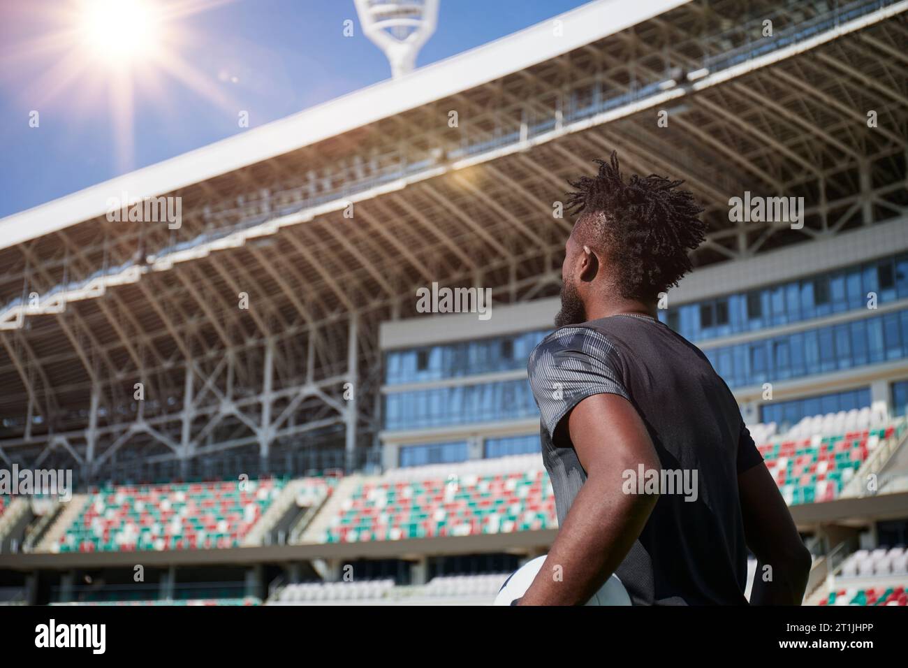 African-American soccer player on training drill. Legs of footballer ...