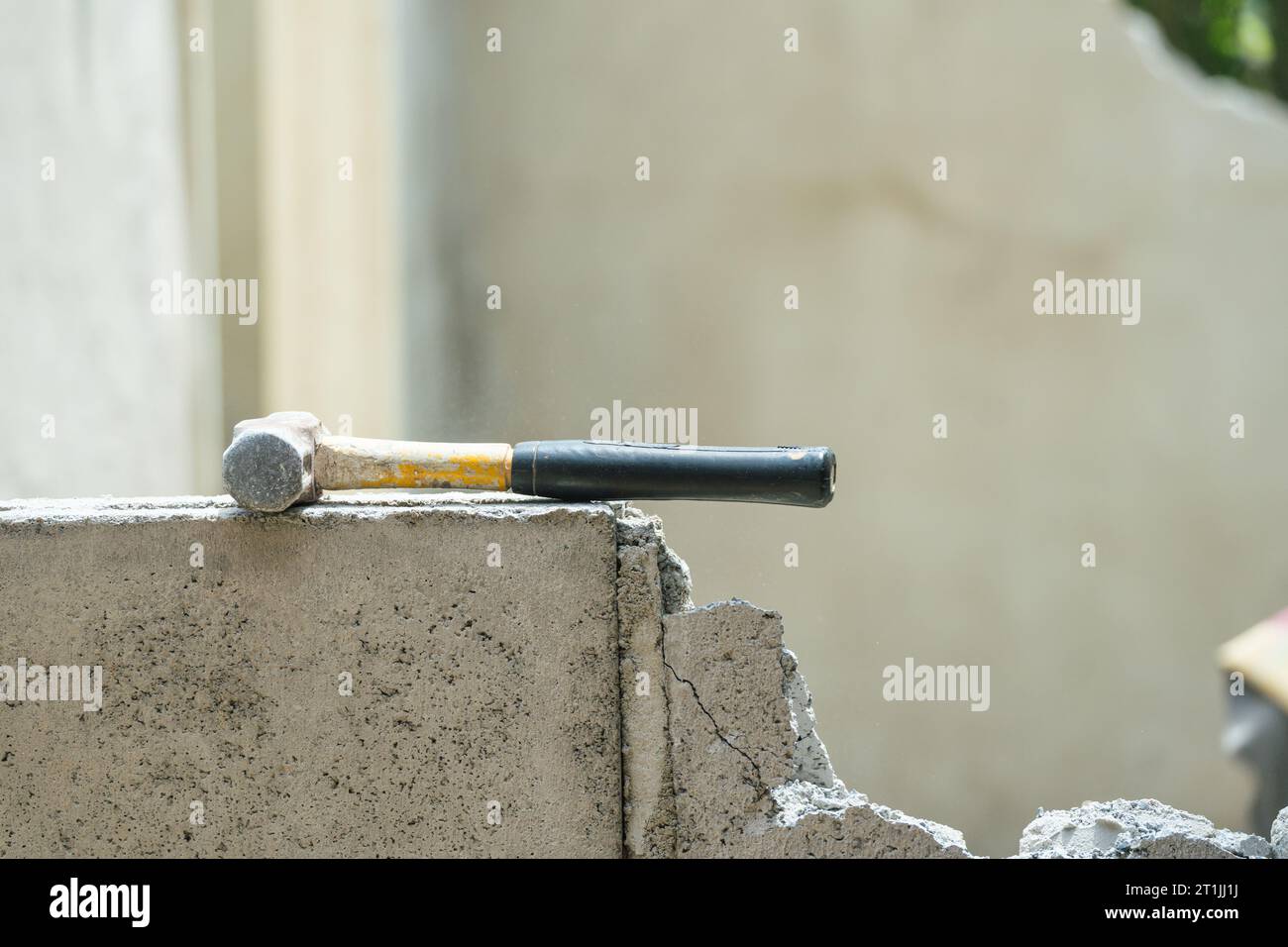 Industrial hammer put it on crash brick wall for smash and demolish in ...
