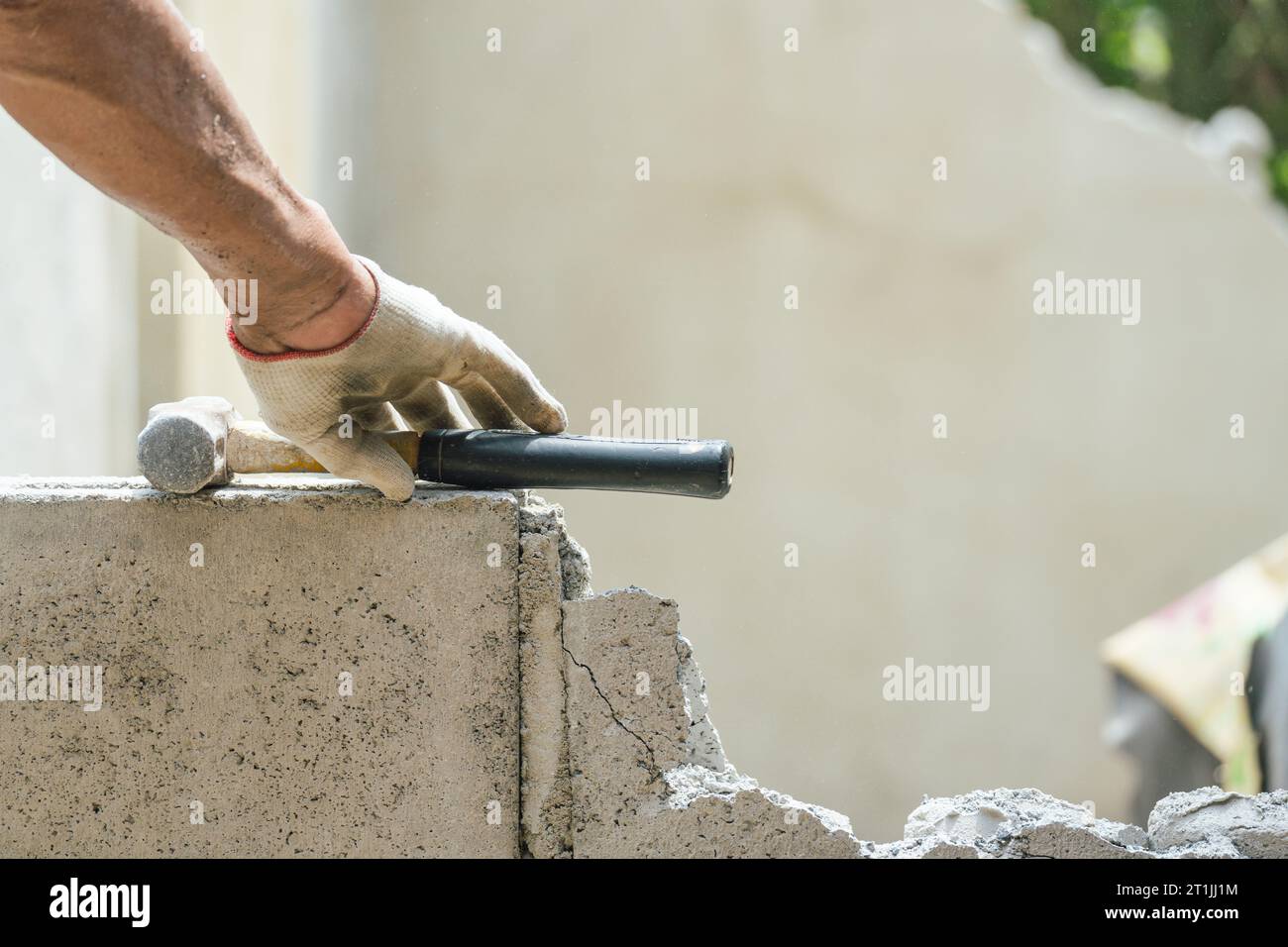 Industrial hammer put it on crash brick wall for smash and demolish in ...