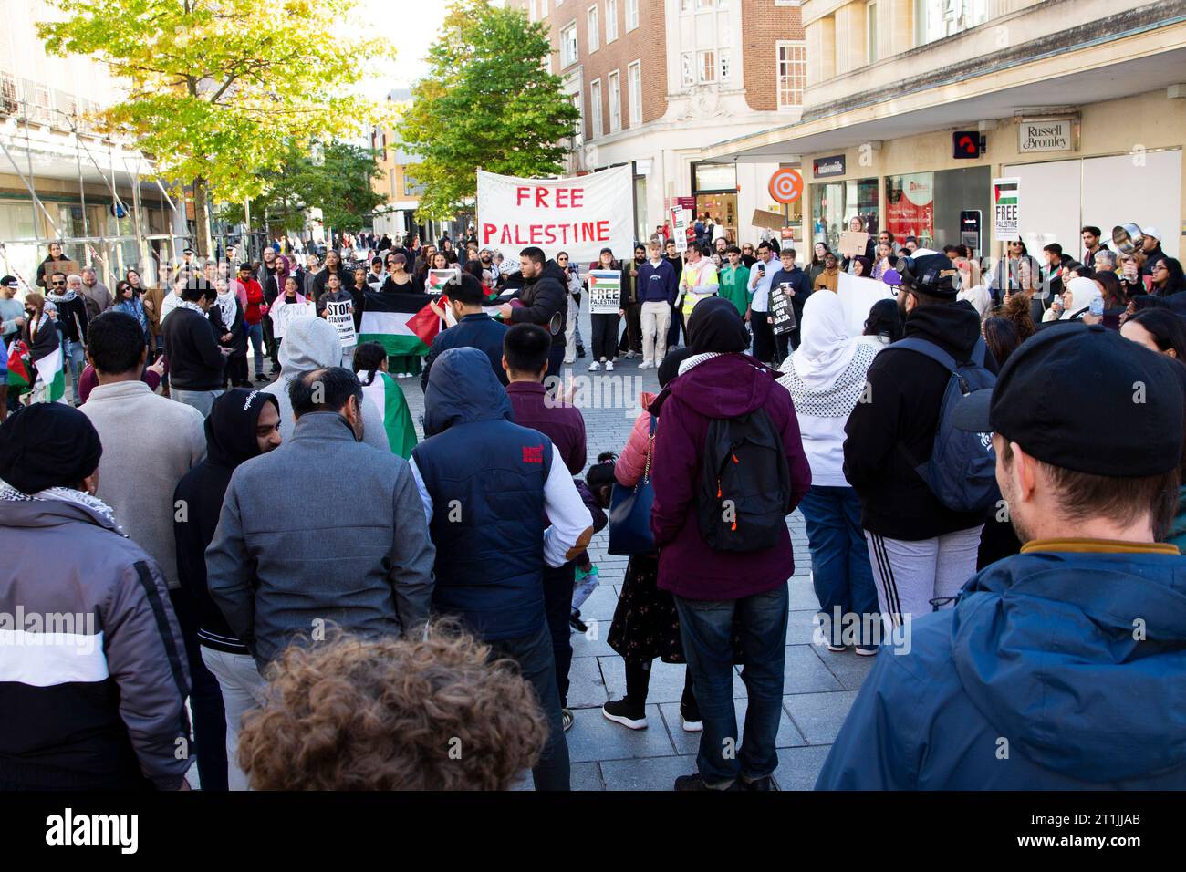 Free Palestine protest Exeter - large crowd stand in circle with ...