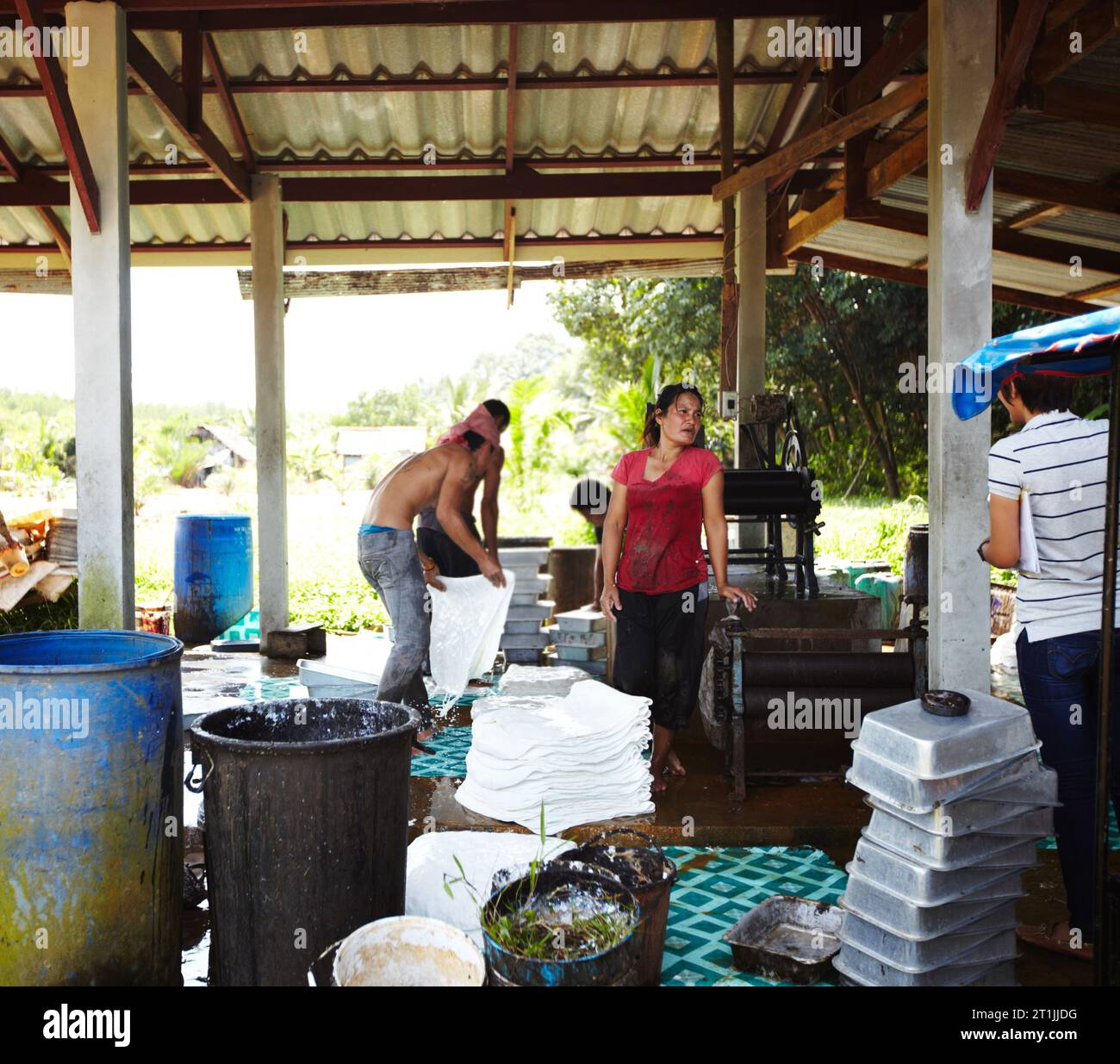 Rubber, manufacturing and people in workshop, factory and production ...