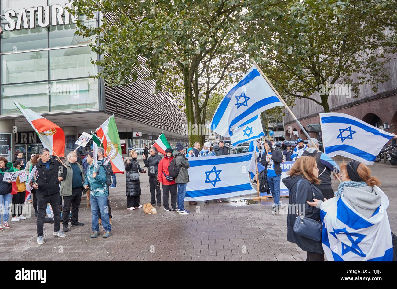 Hamburg, Germany. 14th Oct, 2023. Demonstrators carrying flags of pre ...