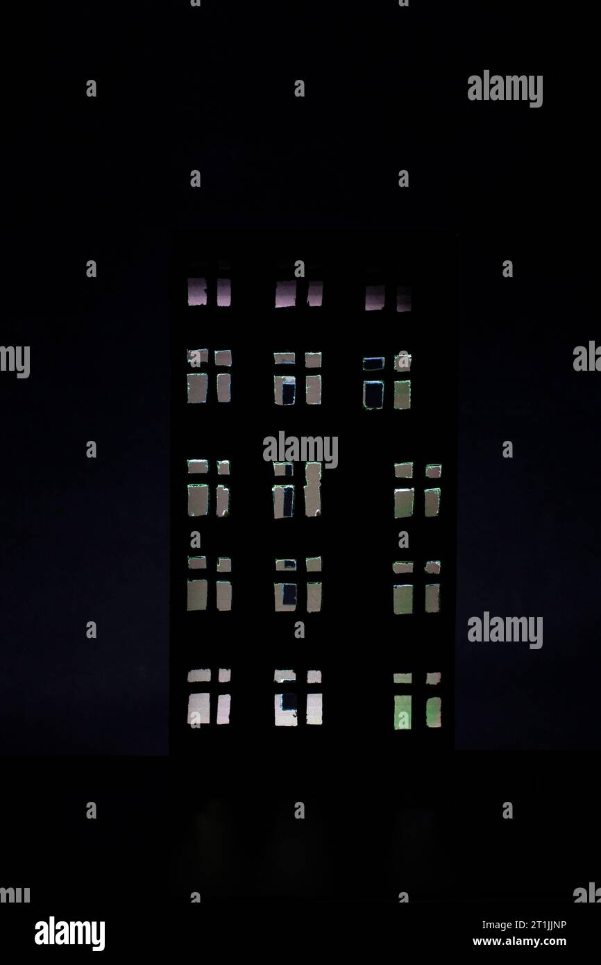 A cardboard cut-out house with windows on a black background Stock ...