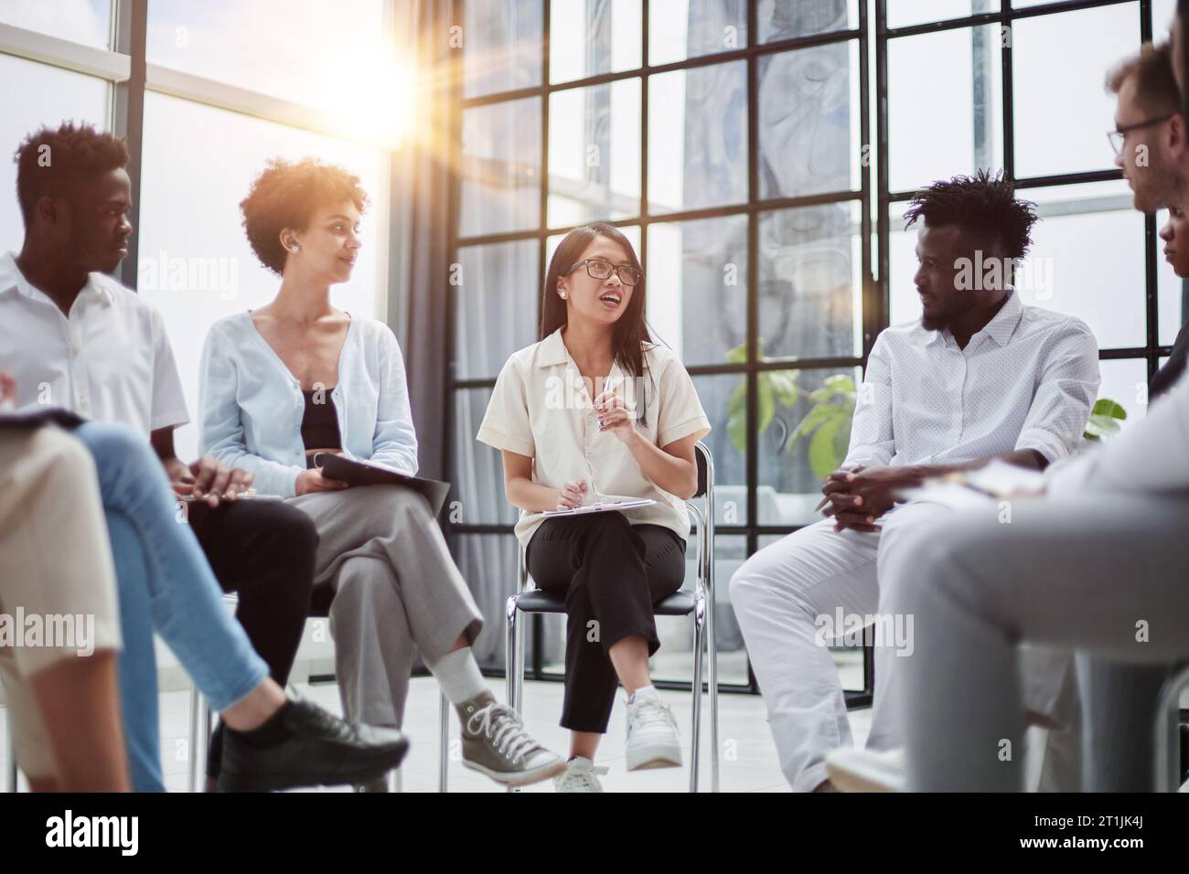 Business and entrepreneurship. sitting in a modern office and giving a ...