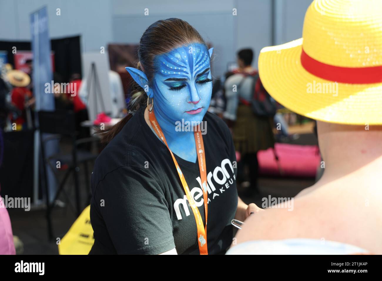 Makeup artist Madison Goode applies makeup for a cosplayer during New ...