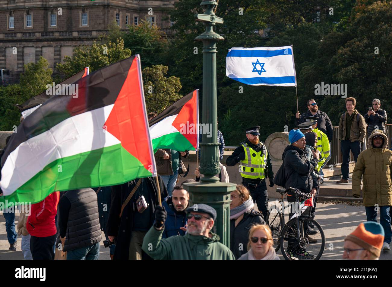 A man flies an Israeli flag during a Scottish Palestine Solidarity ...