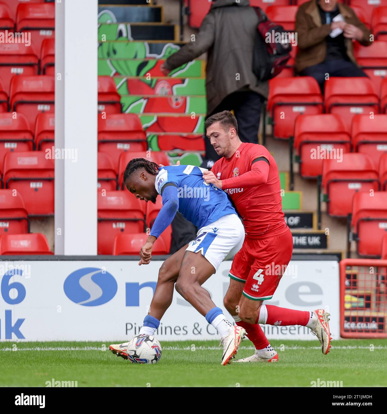 Walsall, UK. 14th Oct, 2023. Gillingham's Cheye Alexander & Walsall's ...
