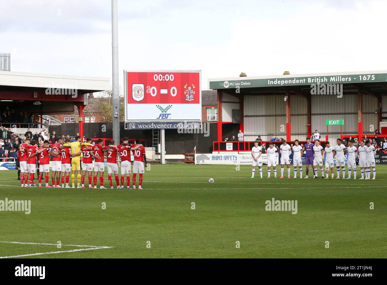 Crewe, UK. 14th Oct, 2023. Players of Crewe and Tranmere line up for a ...