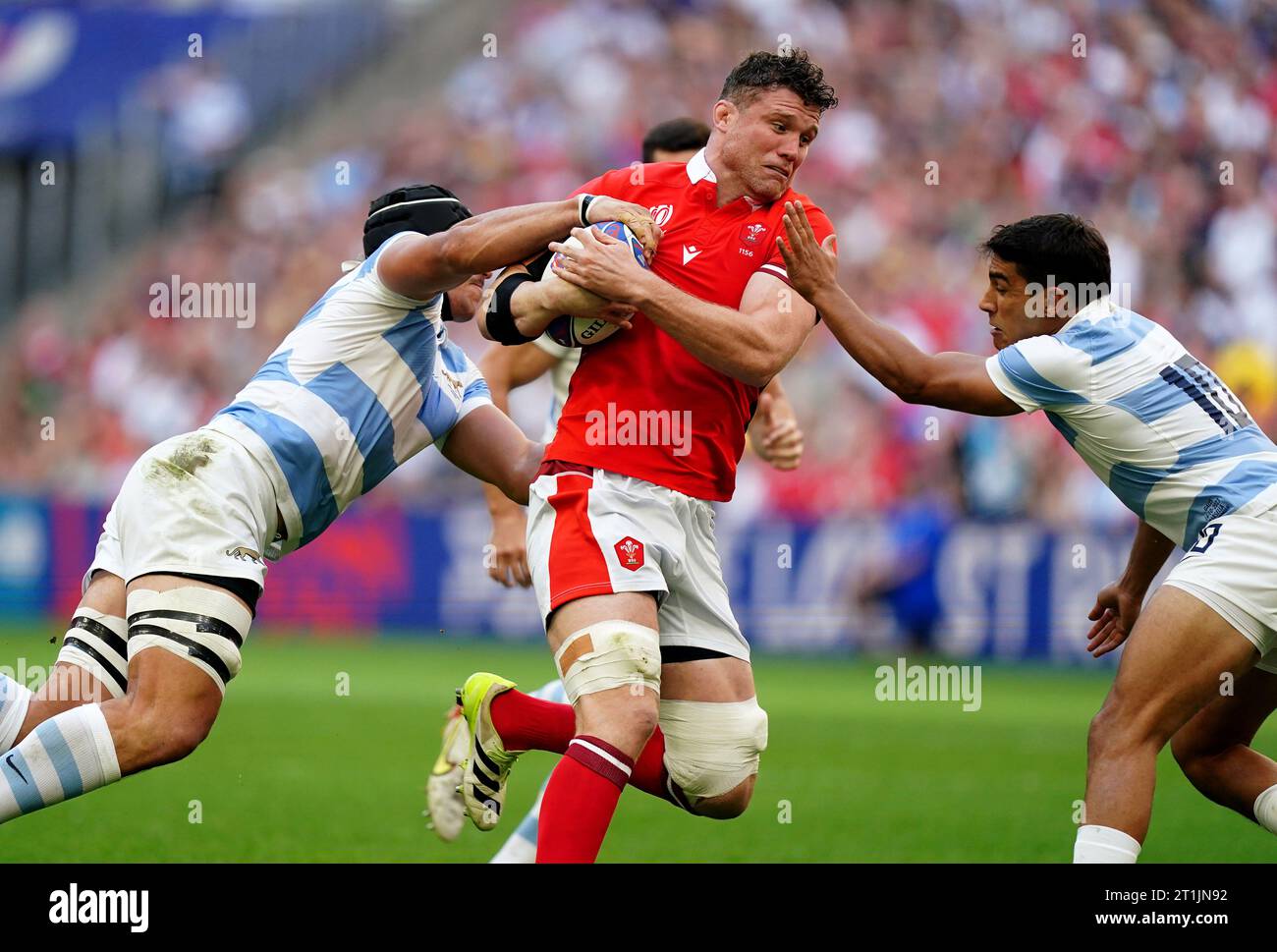 Wales' Will Rowlands (centre) is tackled by Argentina's Tomas Lavanini ...