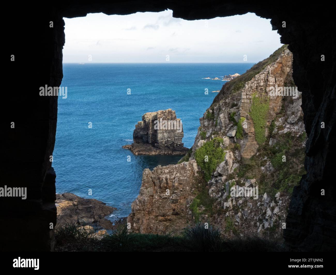 The window in the rock is a square hole cut into the cliff face, giving ...