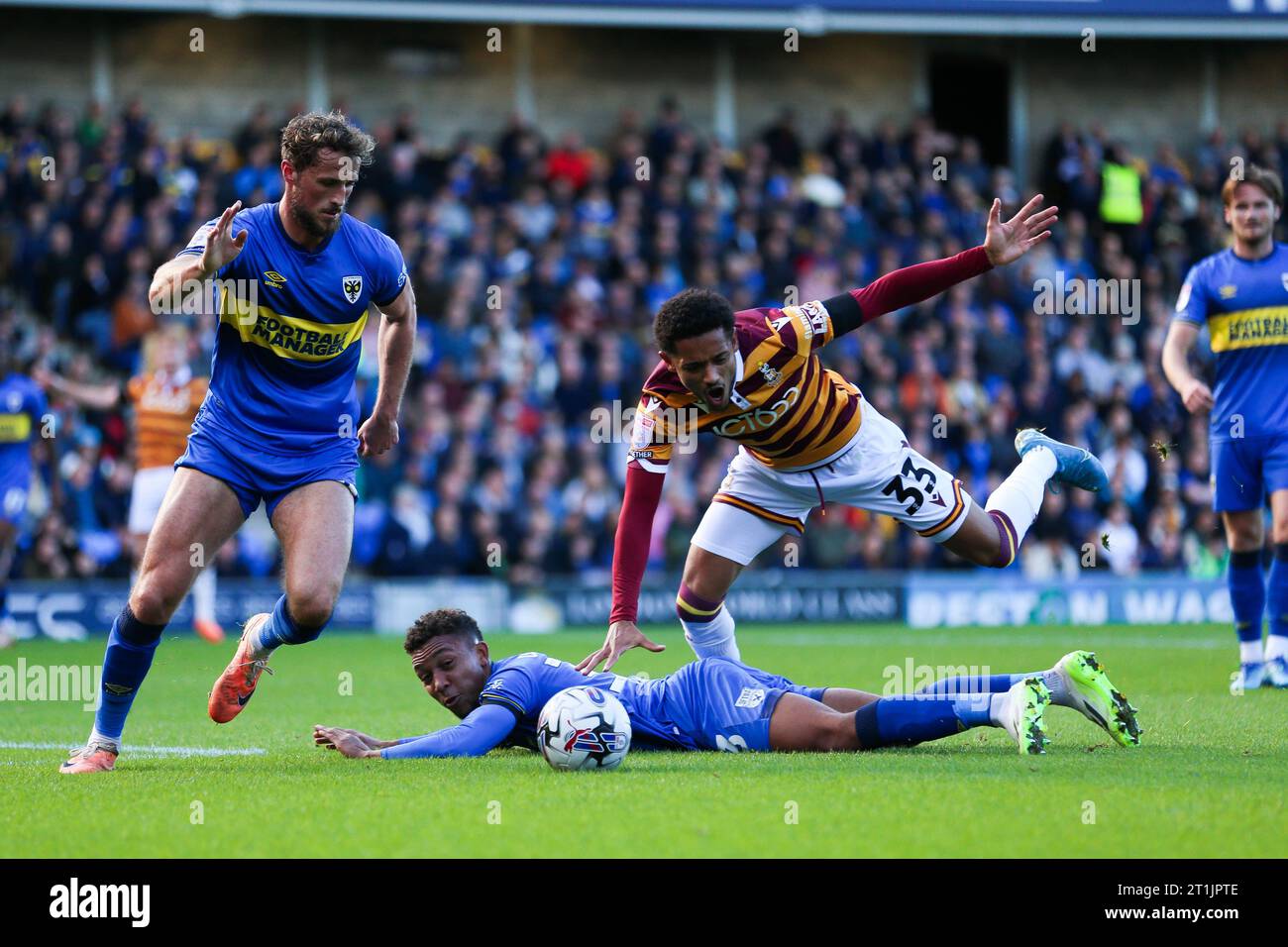 Bradford City's Adam Wilson battles for the ball against AFC Wimbledon ...