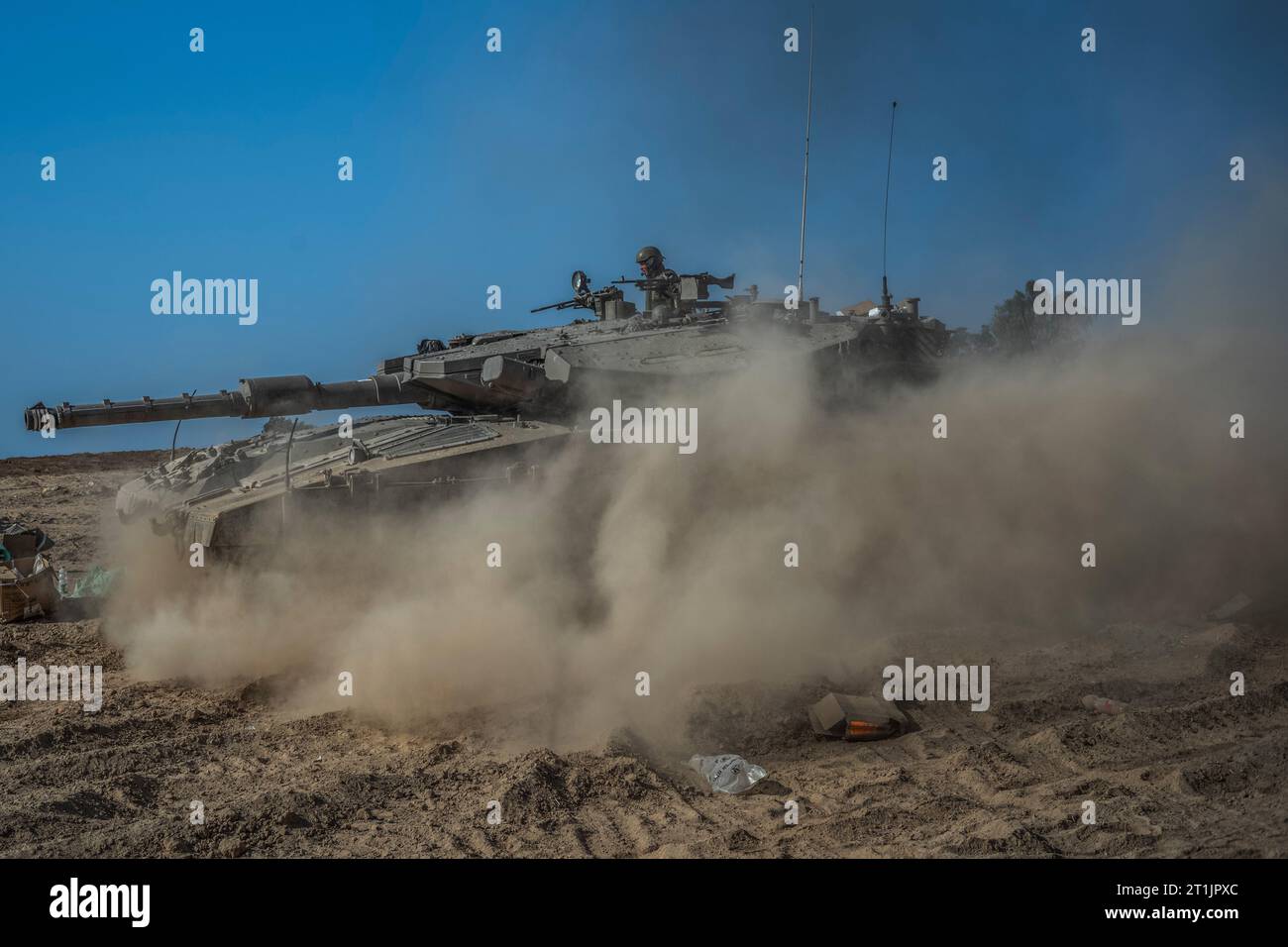 14 October 2023, Israel, Be·eri: A tank moves through the area near ...