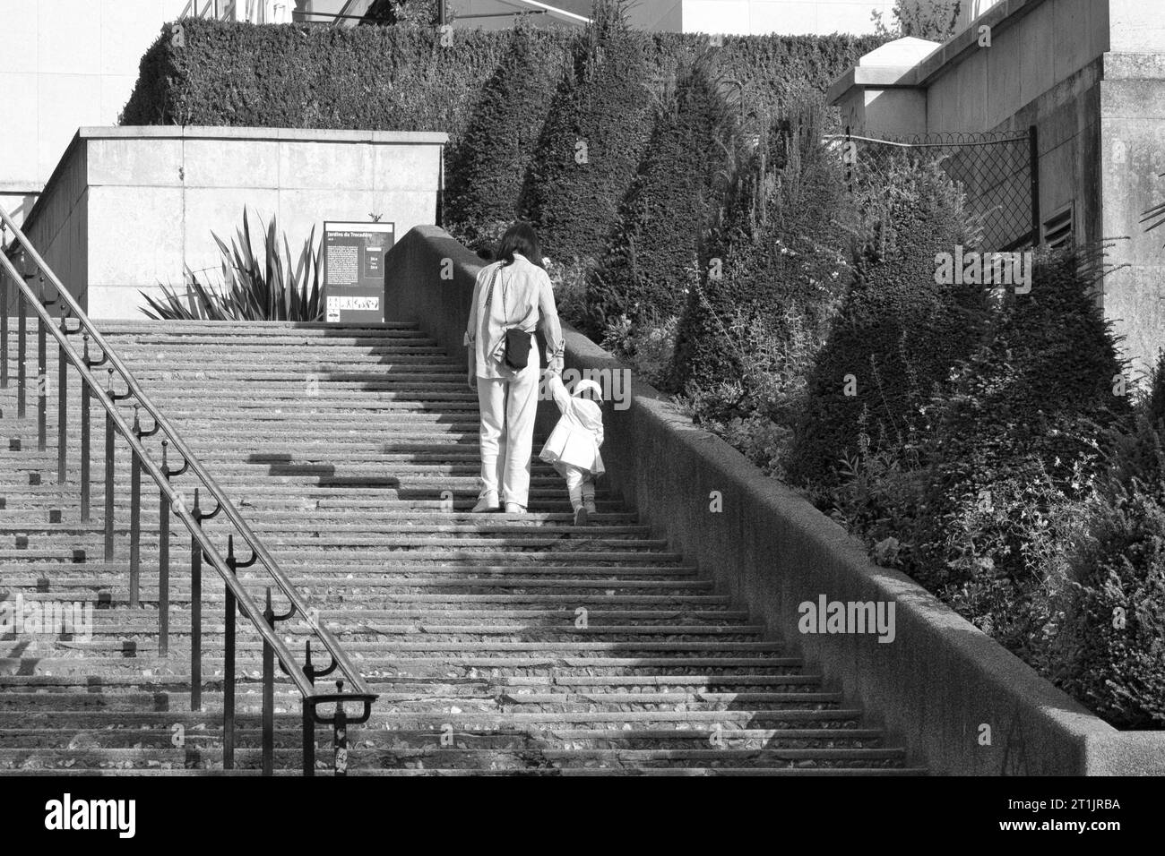 Helping a toddler navigate the steps at the Trocadero, Paris, France ...