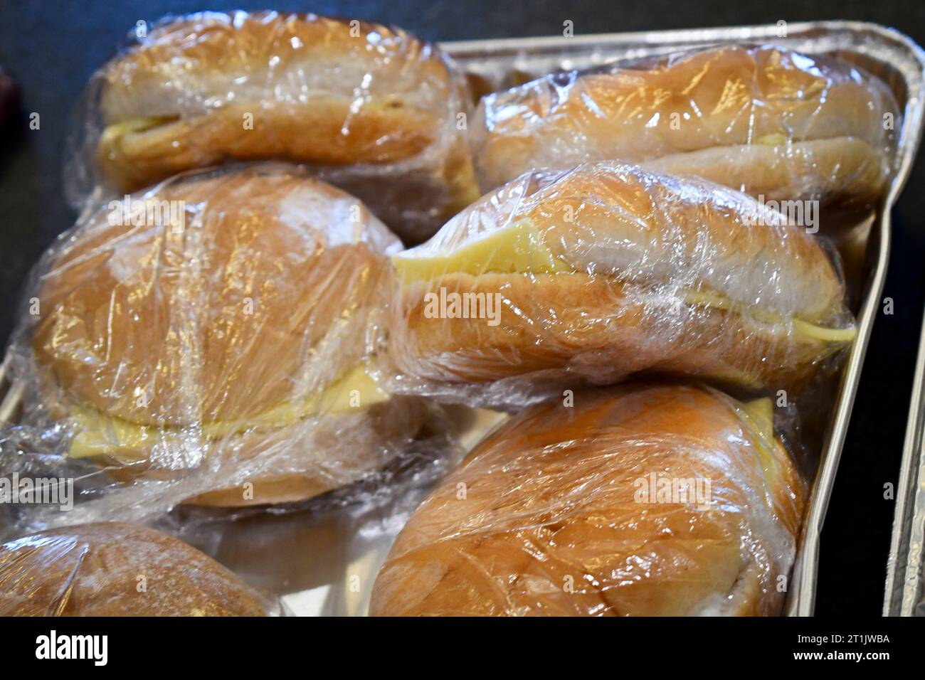 cheese roll wrapped in clingfilm Stock Photo - Alamy