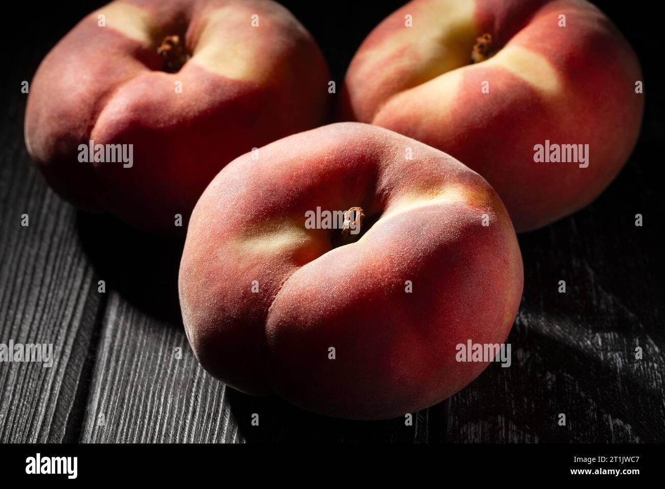 flat peach on wood background Stock Photo - Alamy