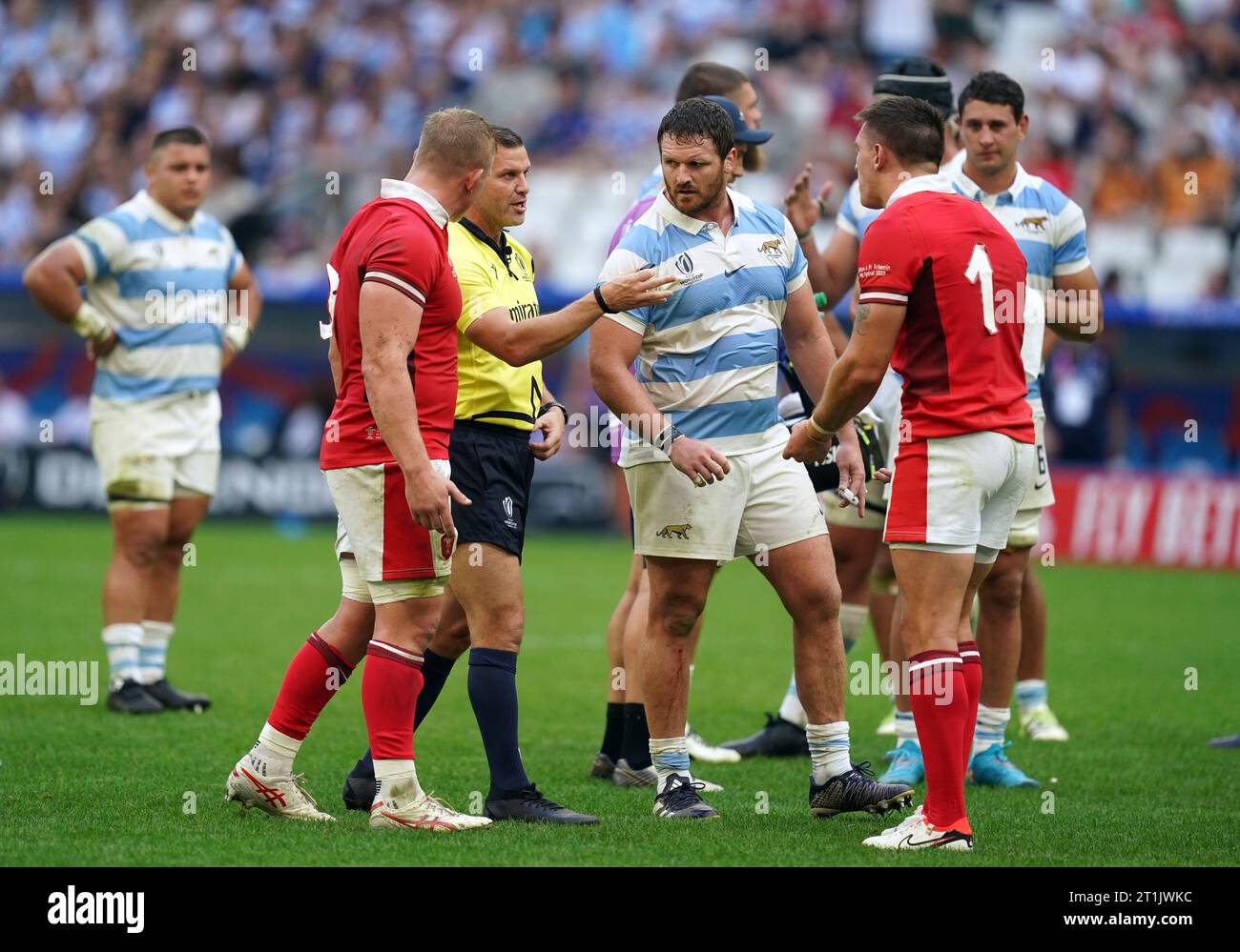 Referee Karl Dickson talks to Wales' Josh Adams during the Rugby World ...