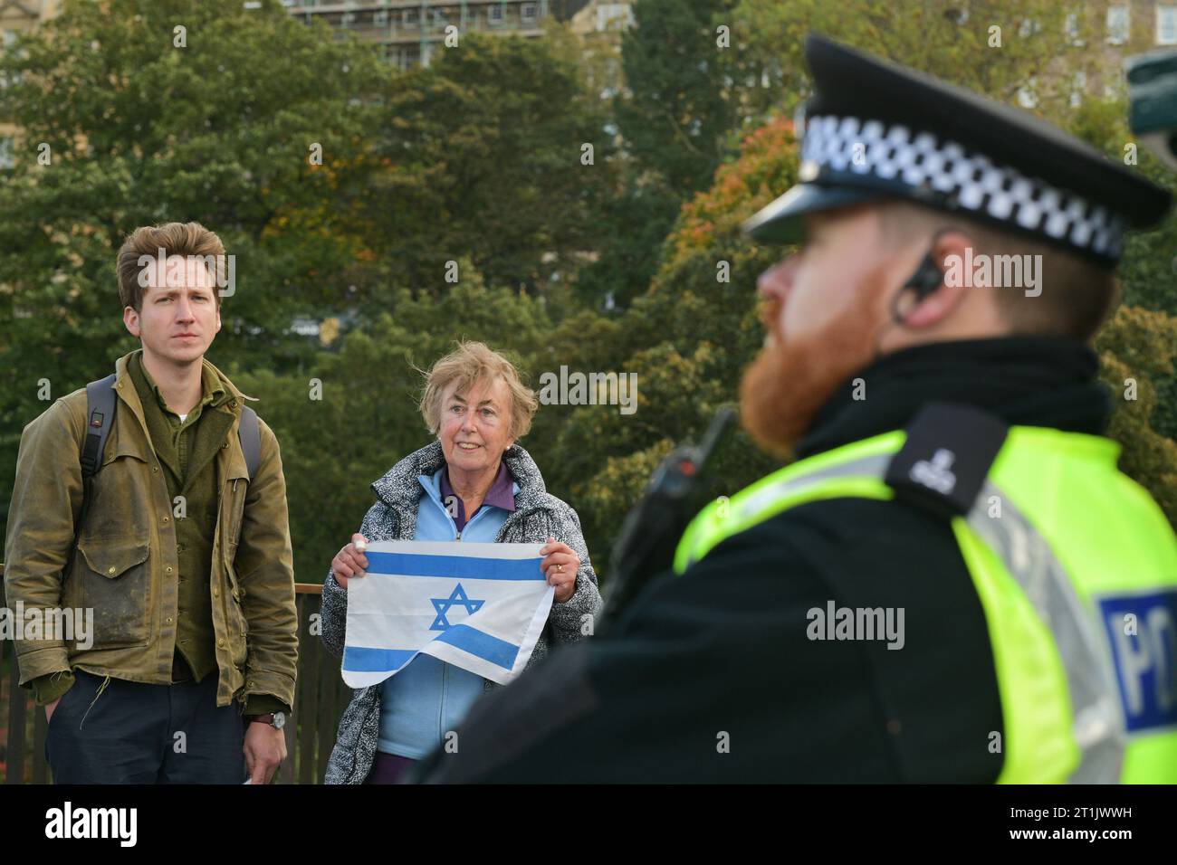 Edinburgh Scotland, UK 14 October 2023. A person displays an Israel ...