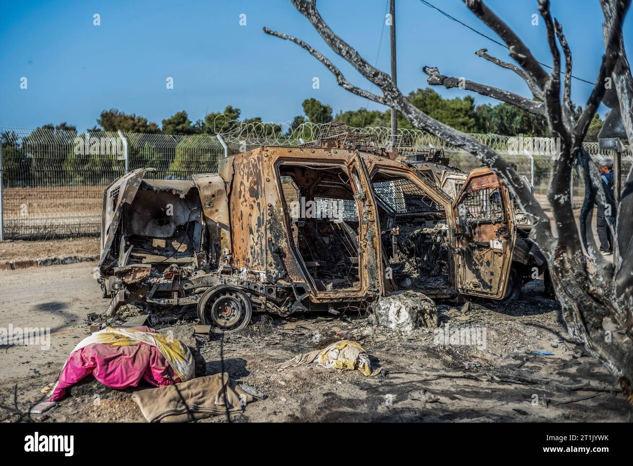 14 October 2023, Israel, Be·eri: Destroyed military vehicles can be ...