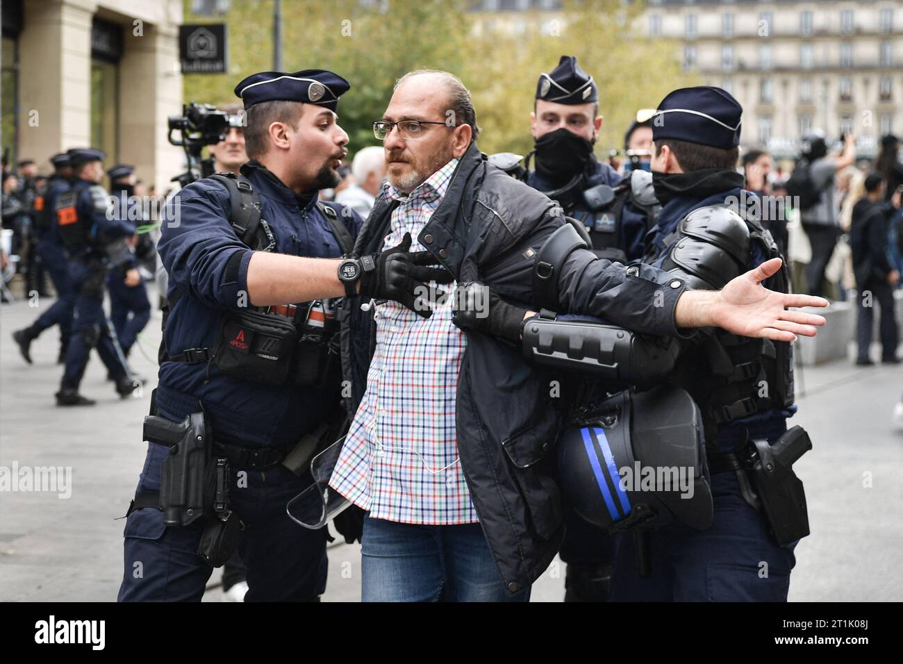 Paris, France. 14th Oct, 2023. Riot police arrest a protester during a ...