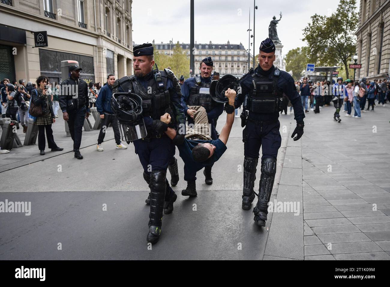 Paris, France. 14th Oct, 2023. Riot police arrest a protester during a ...