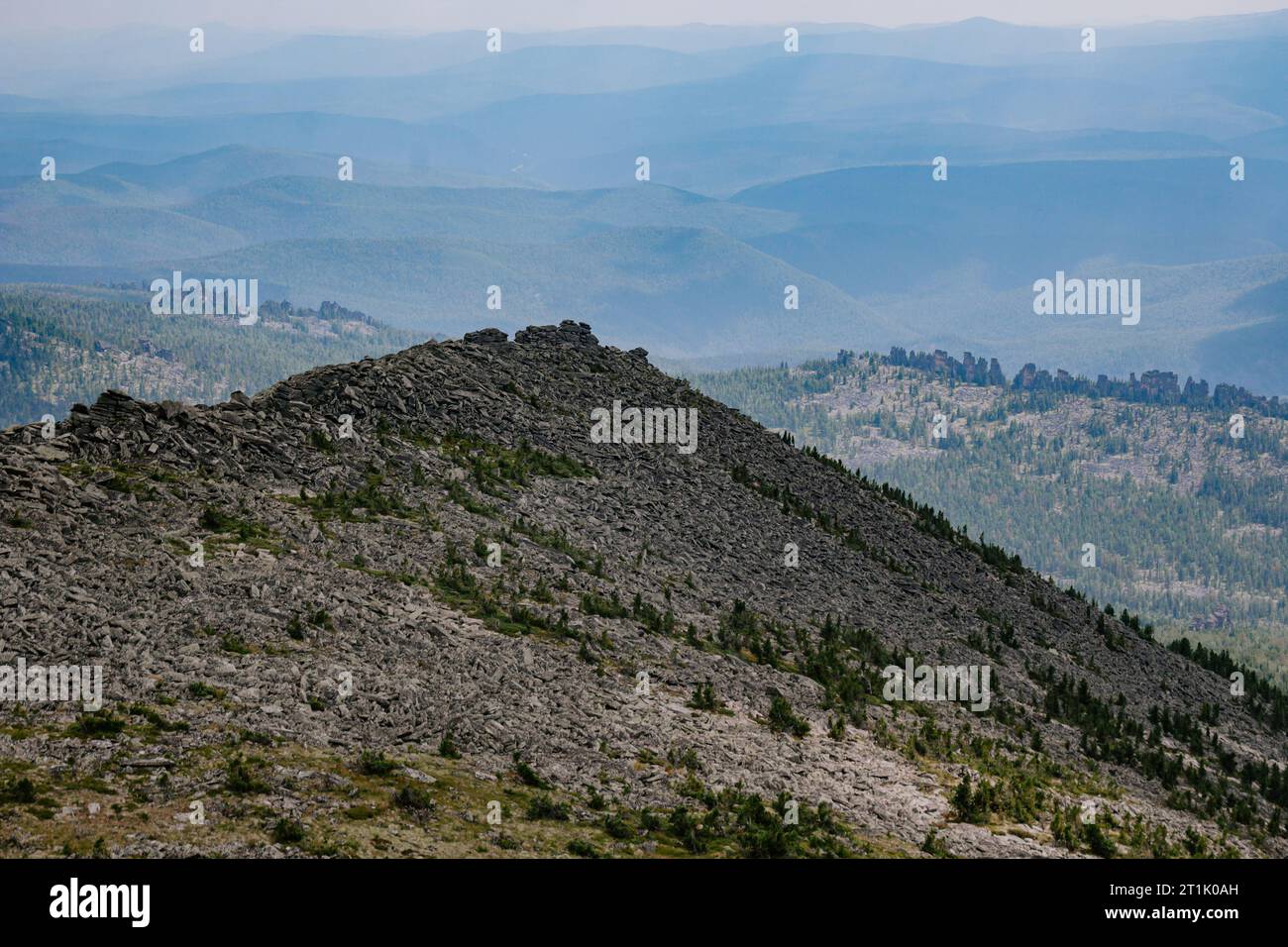 Triangular shaped mountain and hills stretching into the distance to ...