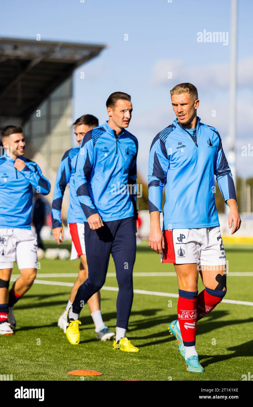 Falkirk, Scotland. 14 October 2023. Tom Lang (2 - Falkirk) warming up ...