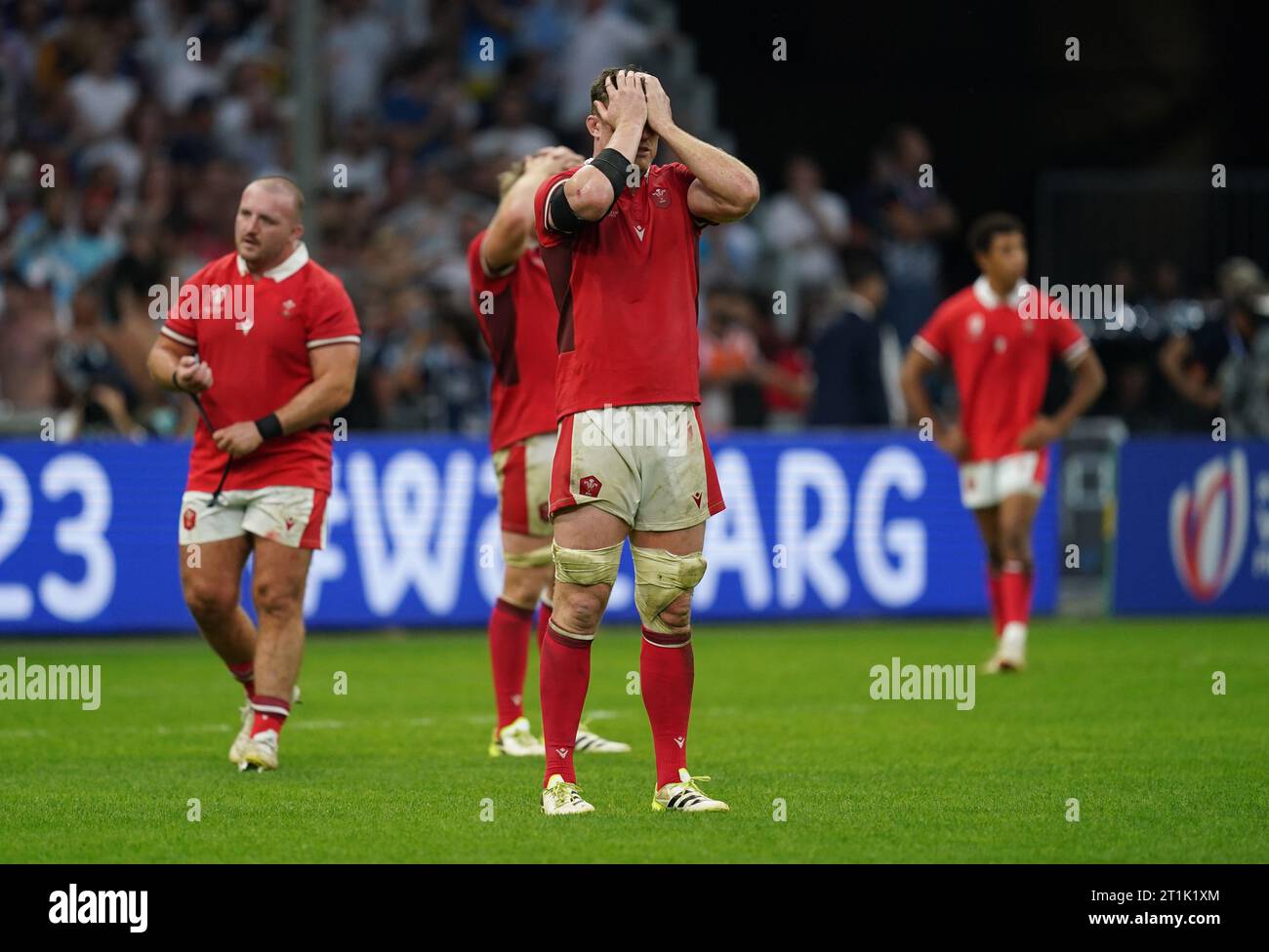 Wales' Will Rowlands looks dejected as he places his hands on his head ...