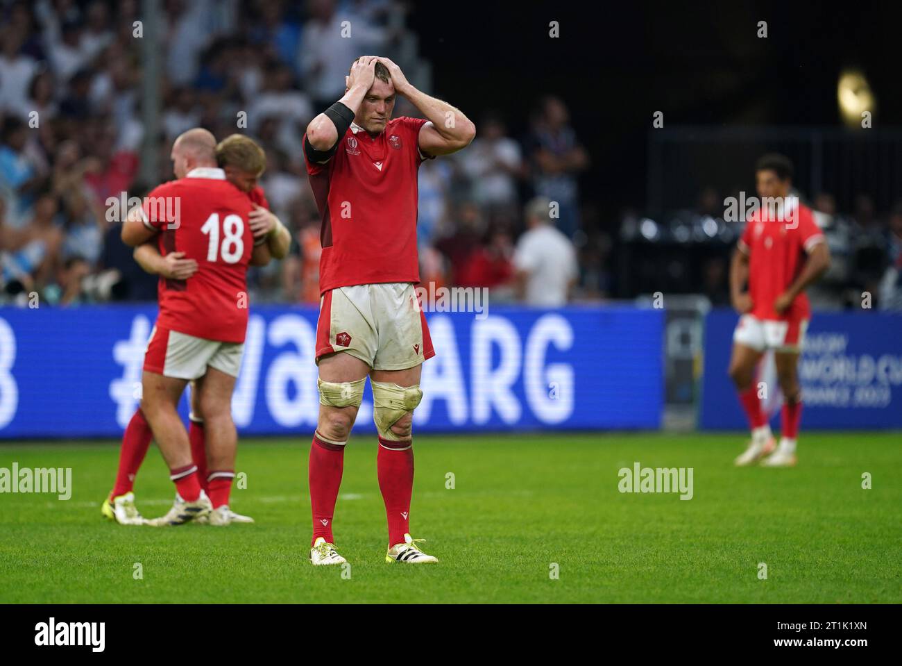Wales' Will Rowlands looks dejected as he places his hands on his head ...