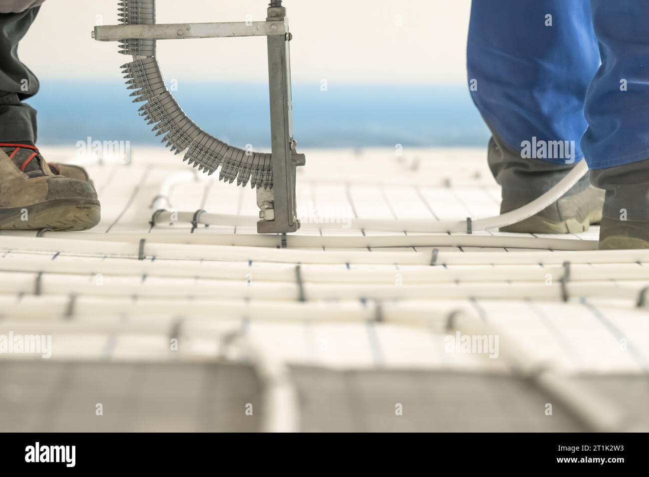 installing floor heating, modernization to save energy Stock Photo - Alamy