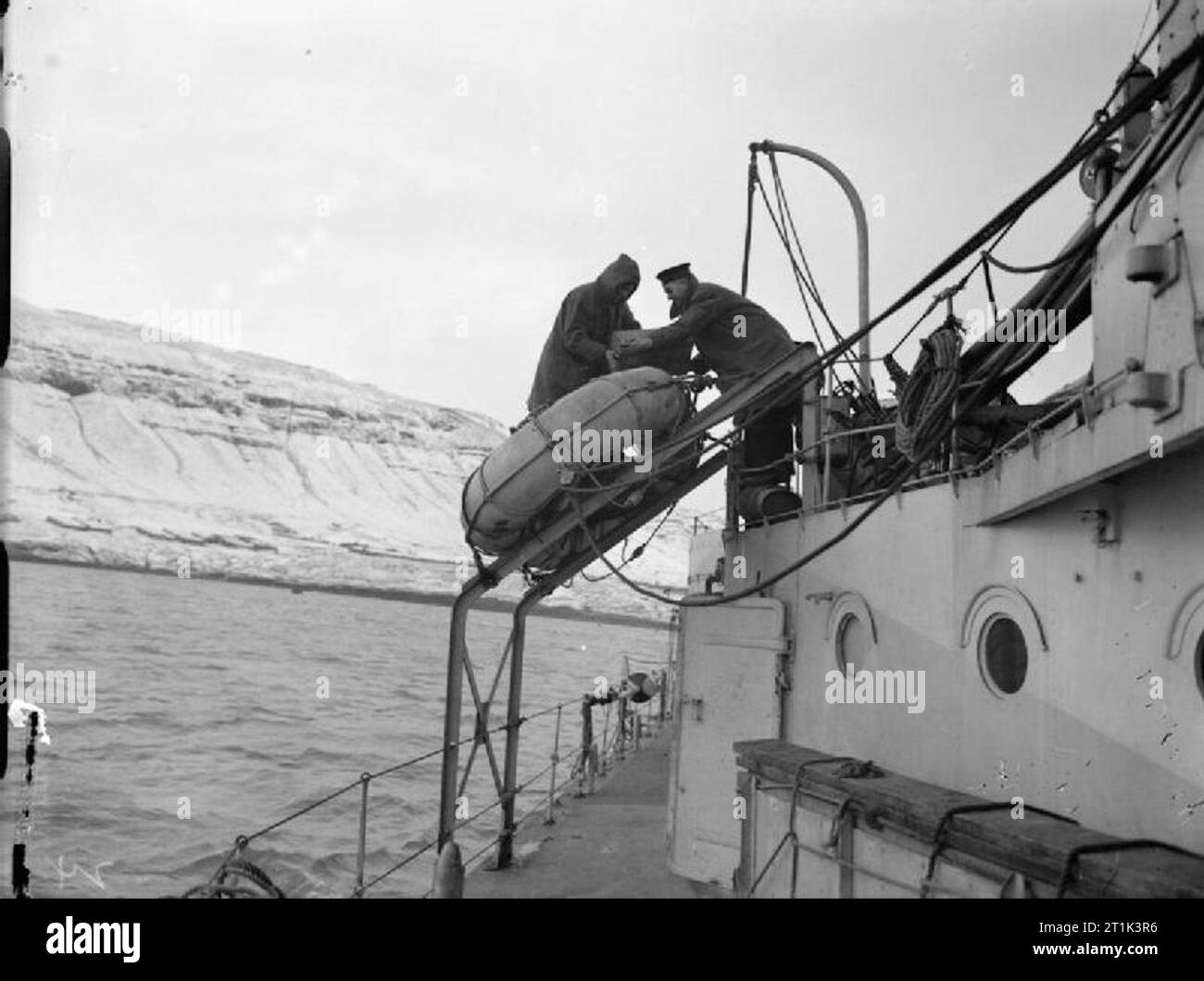 The Royal Navy during the Second World War Two sailors load and attach ...