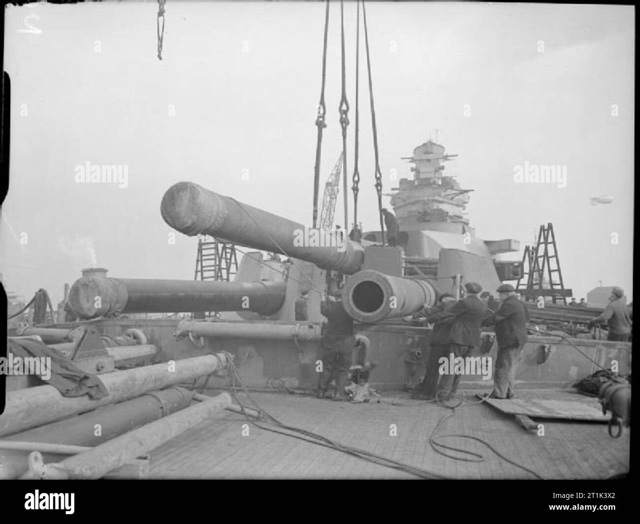 The Royal Navy during the Second World War Lowering the new 14 inch gun ...