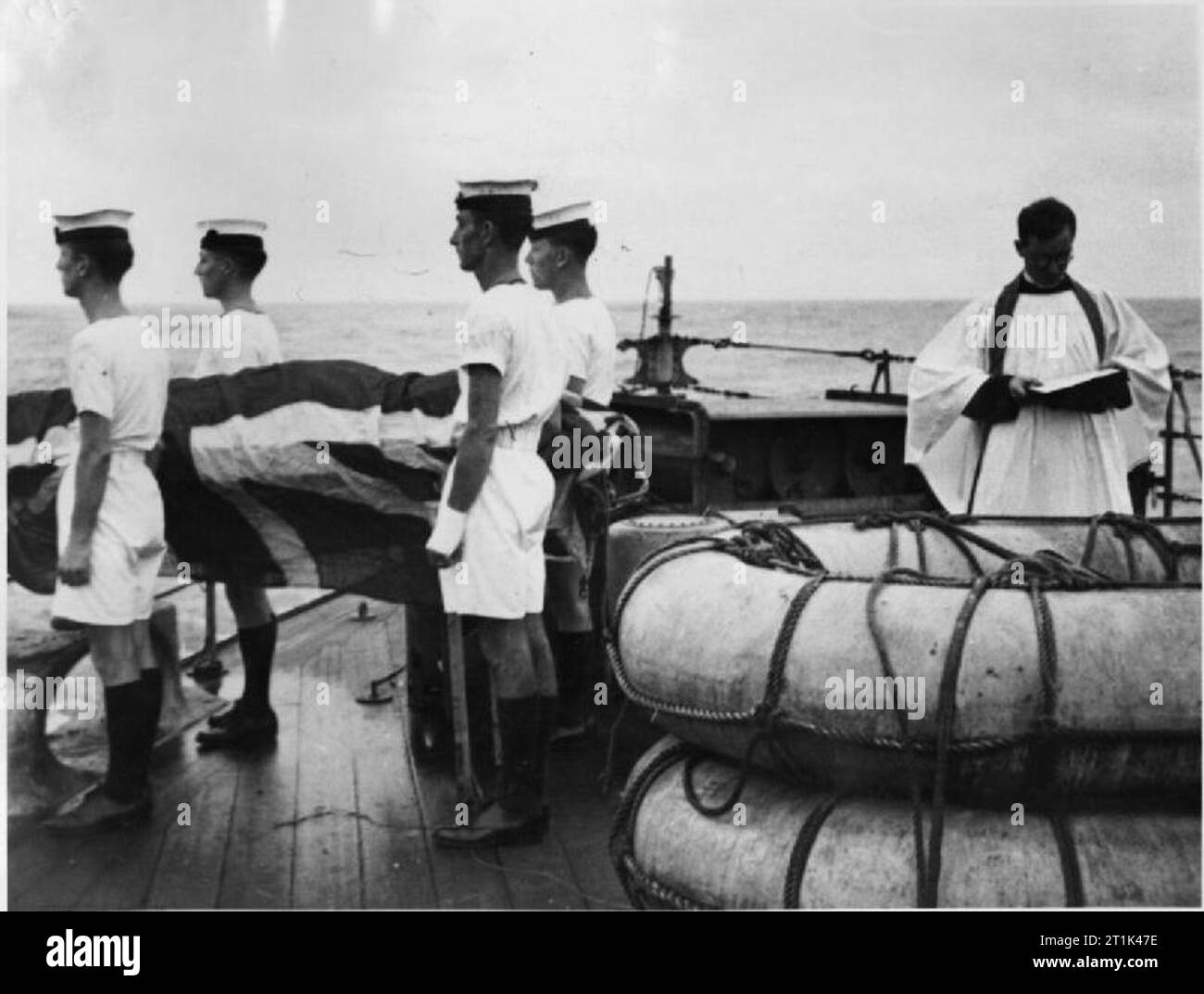 The Royal Navy during the Second World War Four sailors guide the flag ...