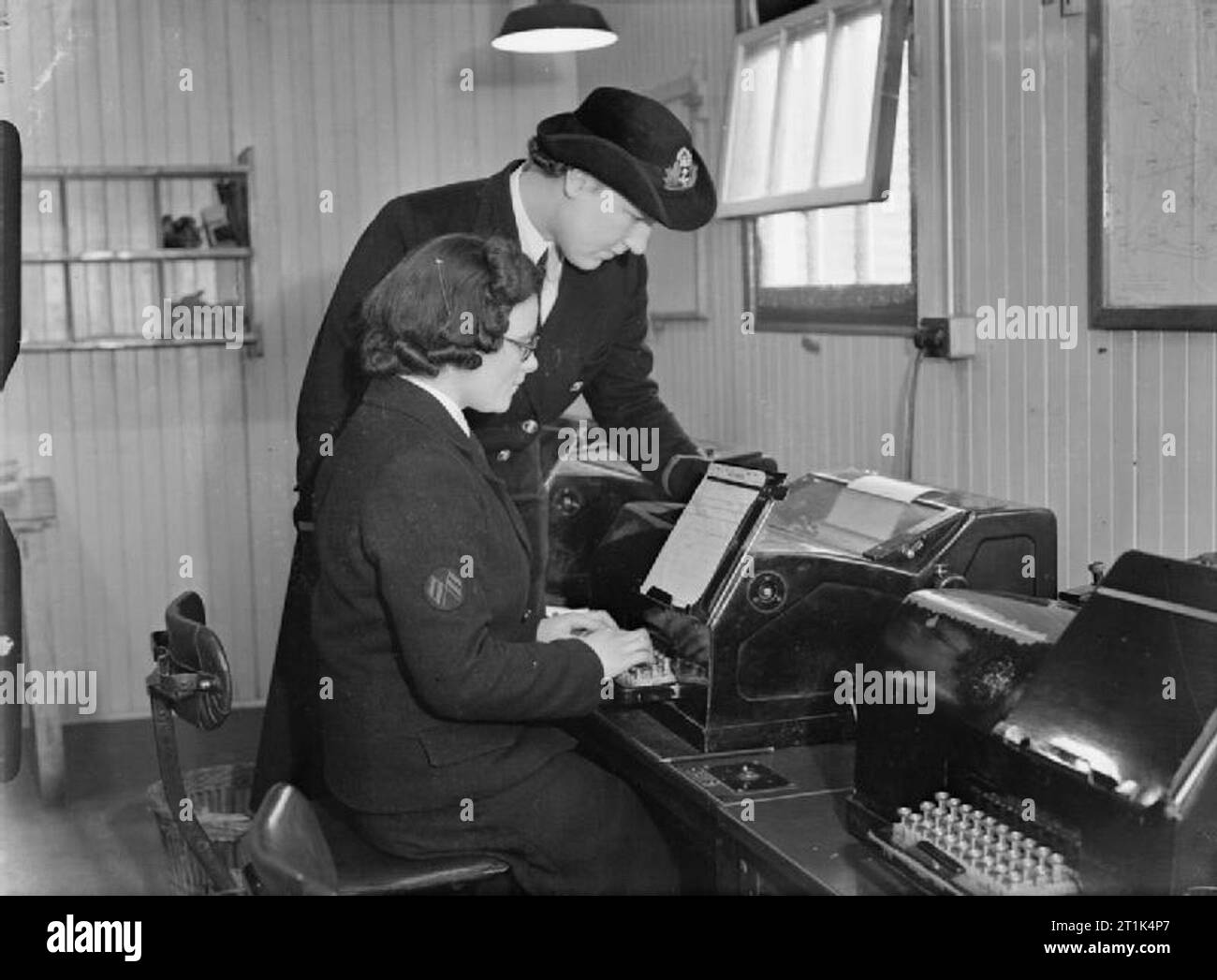 The Women's Royal Naval Service during the Second World War A Wren at work on a teleprinter at a ...