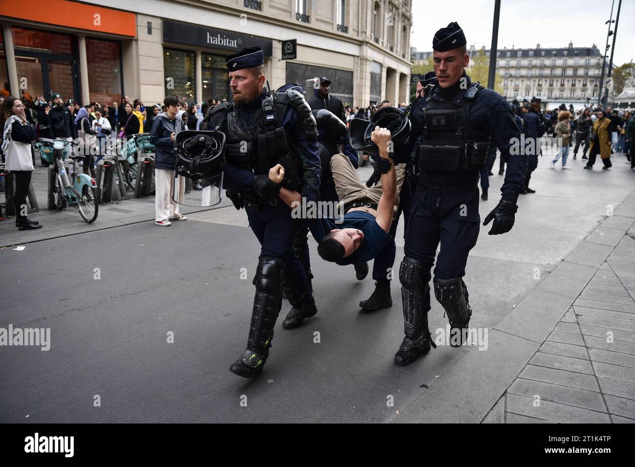 Paris, France. 14th Oct, 2023. Riot police arrest a protester during a ...