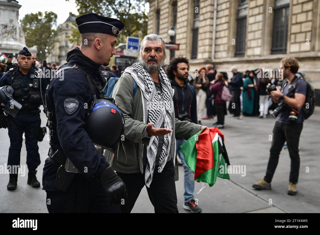 Paris, France. 14th Oct, 2023. Riot police arrest a protester during a ...