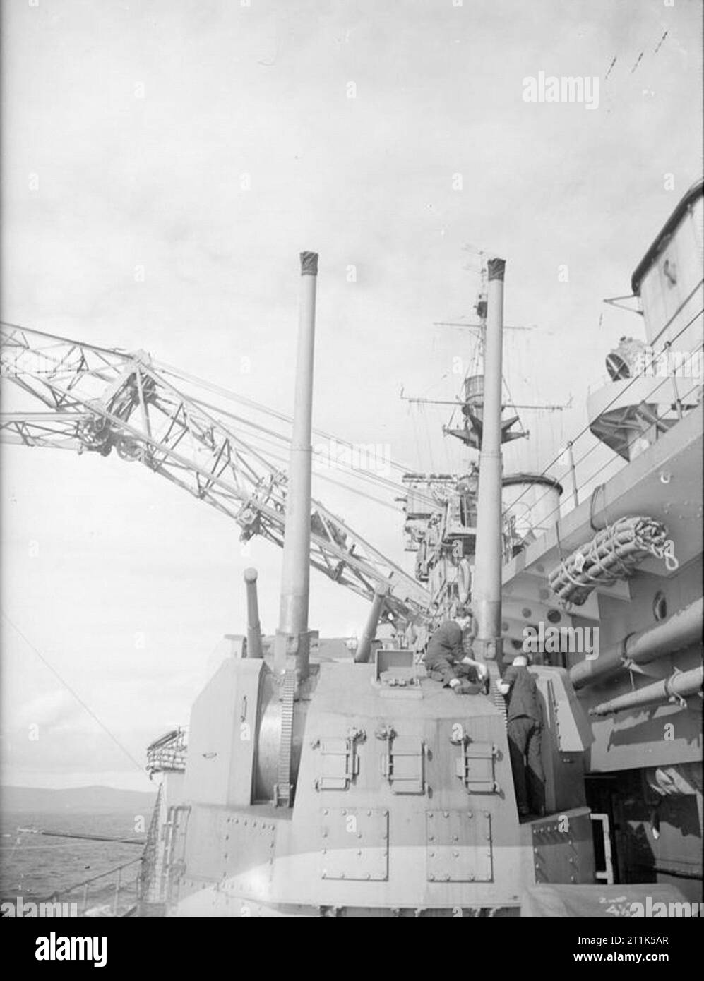 HMS Howe. August 1942. Royal Marines at work on some of the secondary ...