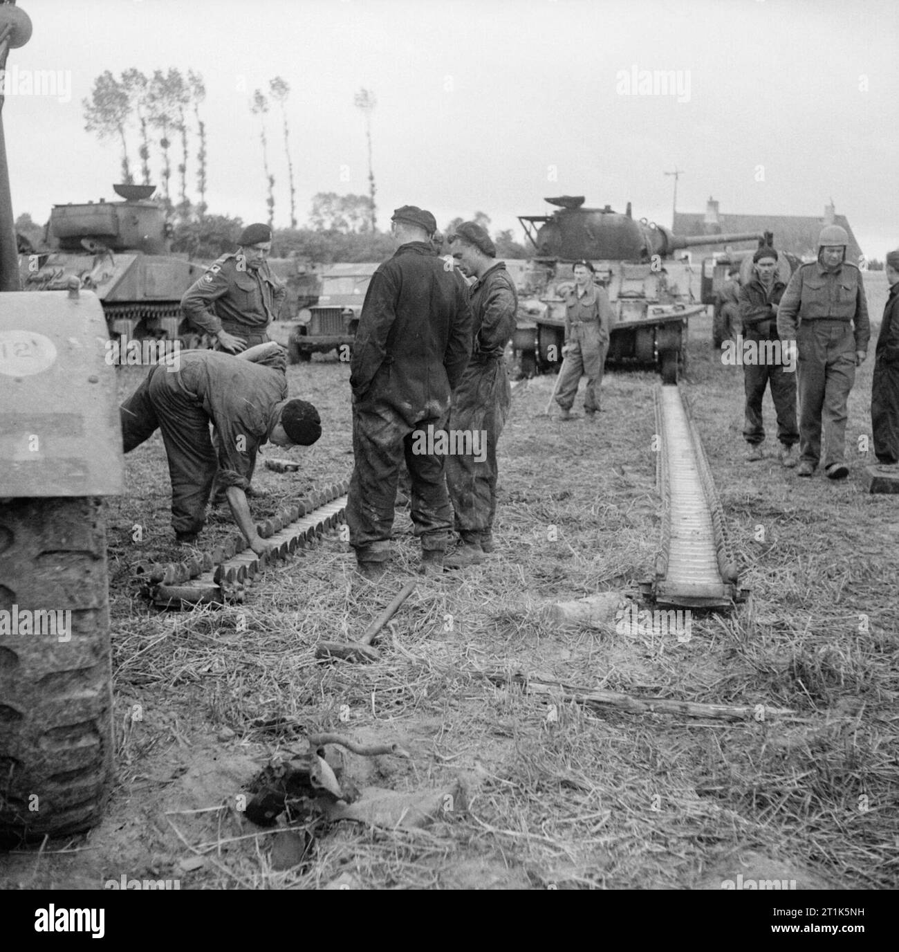 Sherman tanks and other vehicles under repair at a REME depot in ...