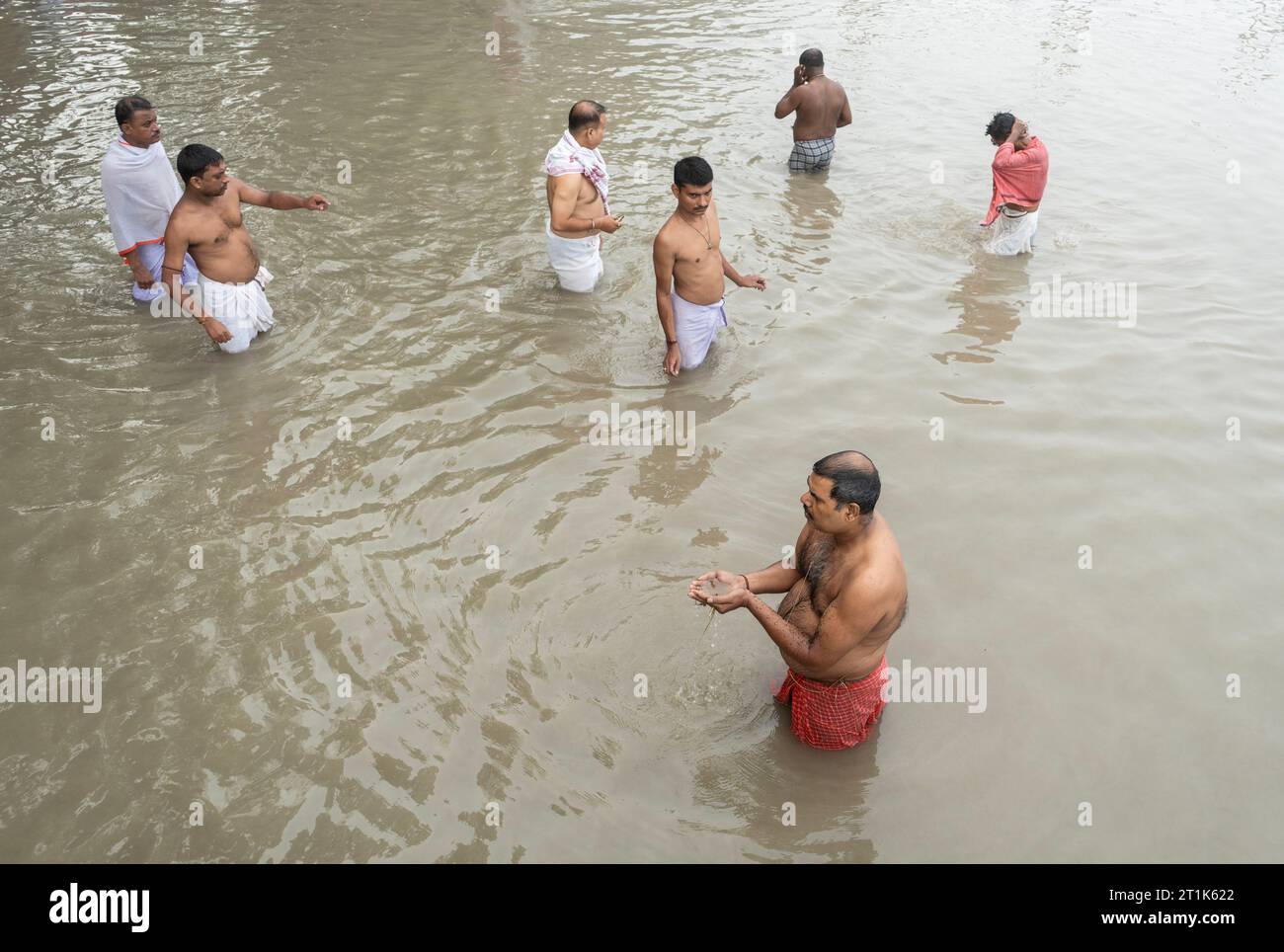 Hindu devotees perform the 'Tarpan' ritual during Mahalaya prayers ...