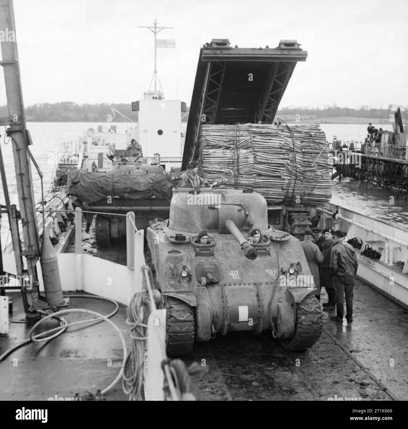 Sherman tanks, a Churchill AVRE with fascine and a Churchill ...