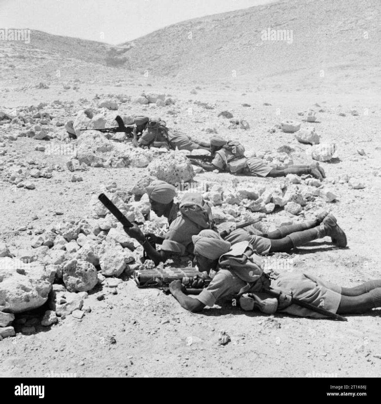 Sikh troops armed with Bren guns and a 2-inch mortar, training in the ...