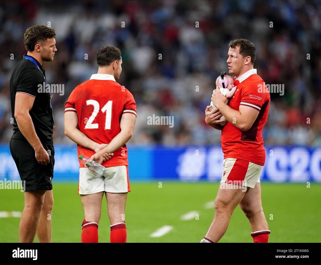Wales' Ryan Elias (right) and Tomos Williams (centre) on the pitch ...