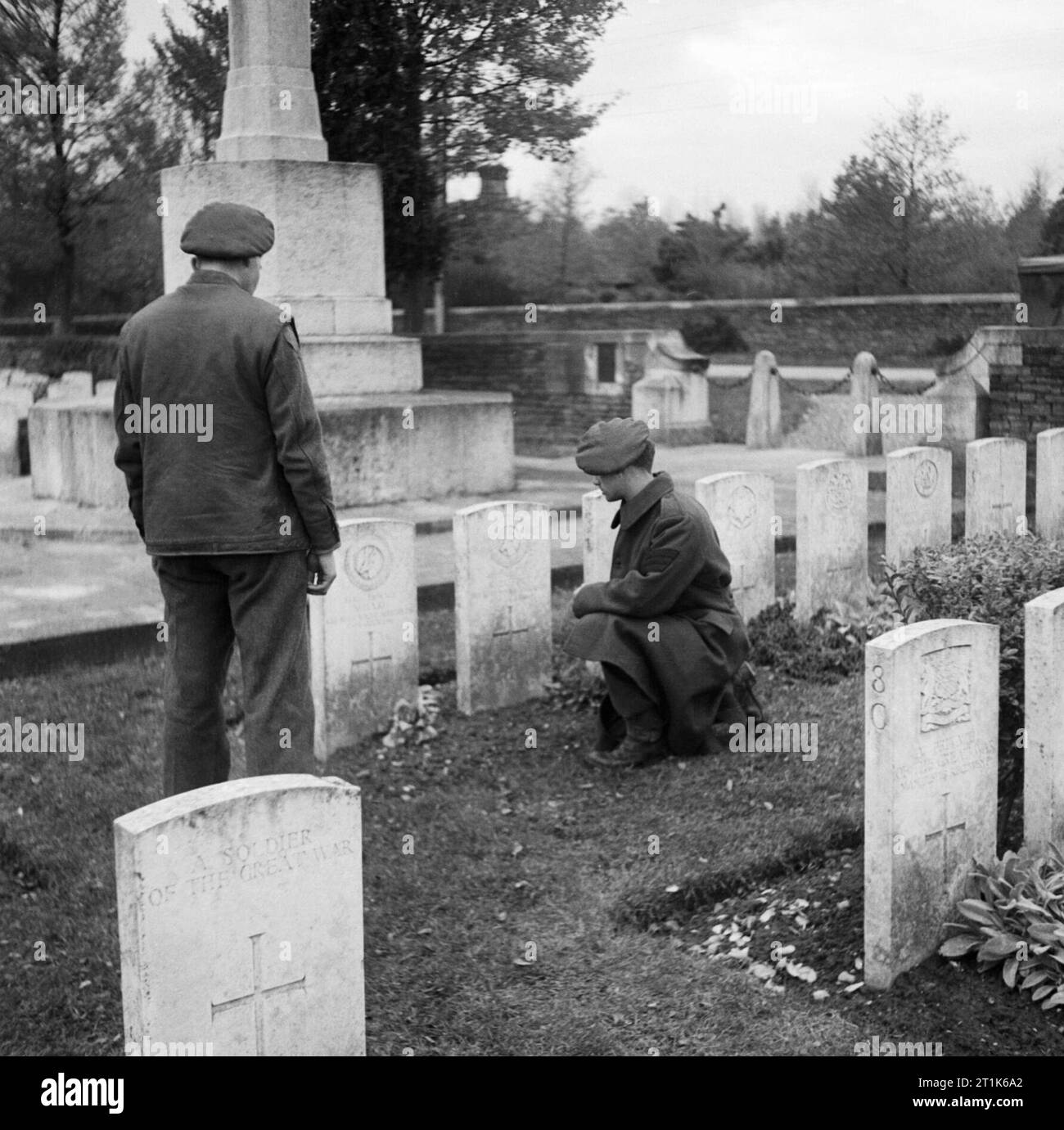 Soldiers inspect graves at the South African First World War cemetery ...