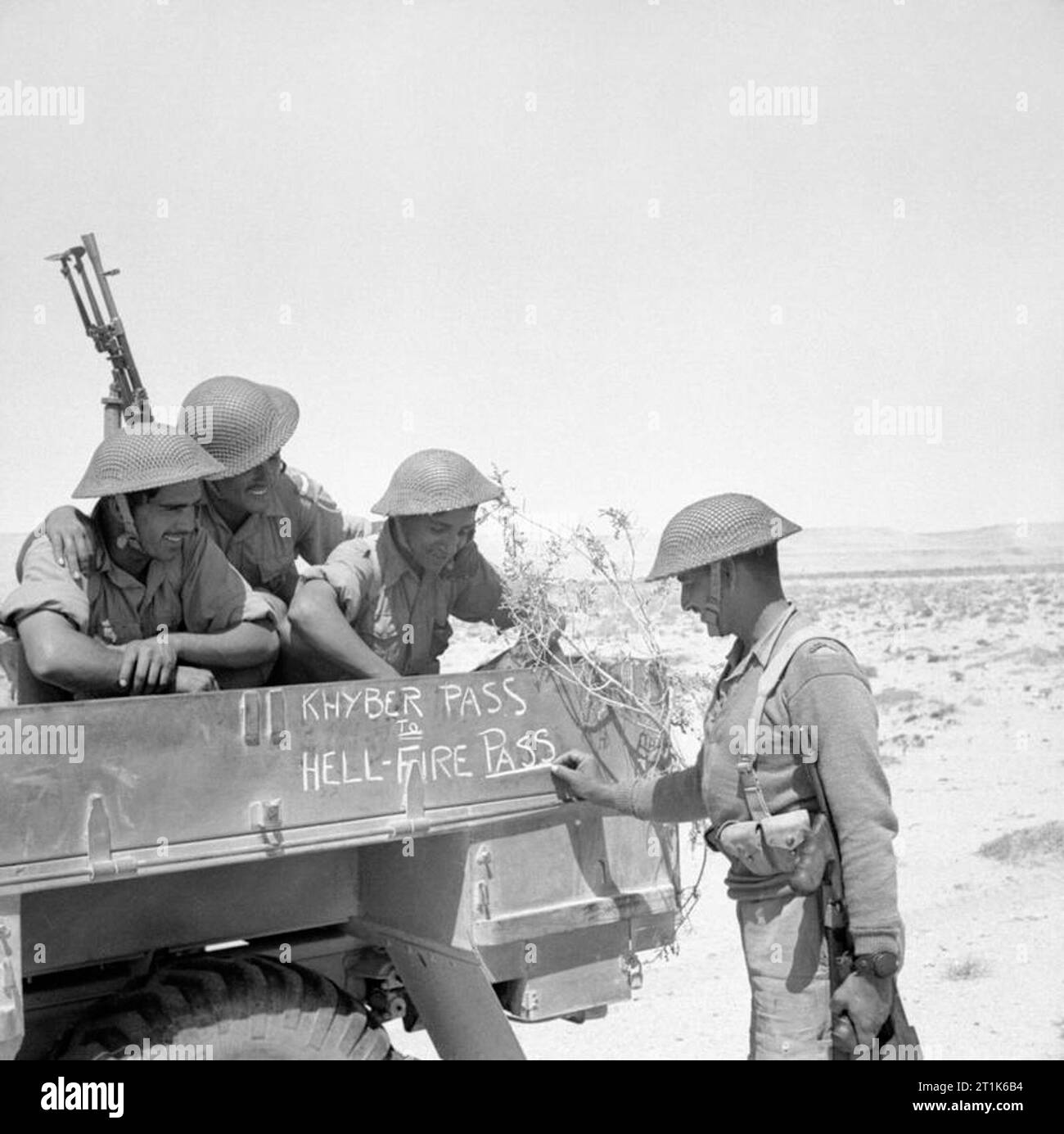 Soldiers of the 4th Indian Division decorate the side of their lorry ...