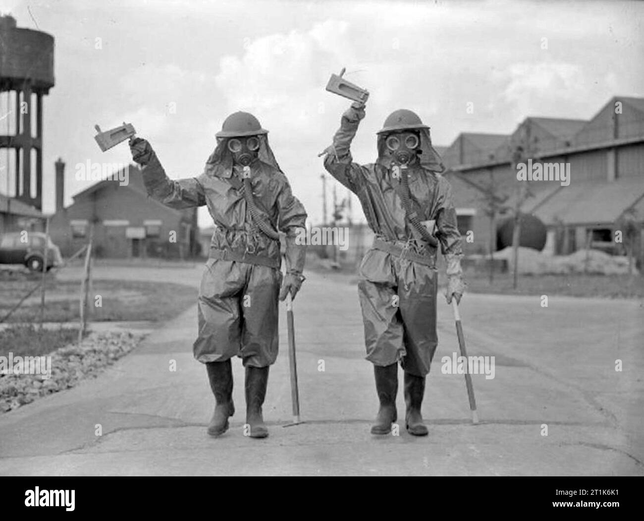 Royal Air Force Bomber Command, 1939-1941. Two airmen dressed in heavy anti-gas clothing and ...