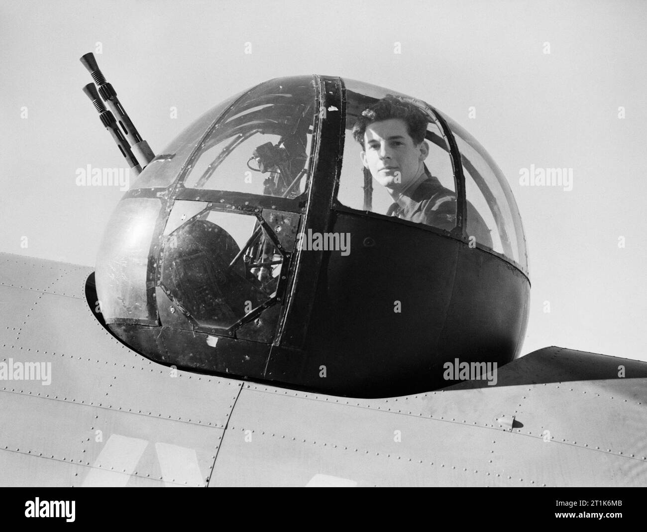Leading Aircraftman Walter 'Spike' Caulfield in the turret of a ...