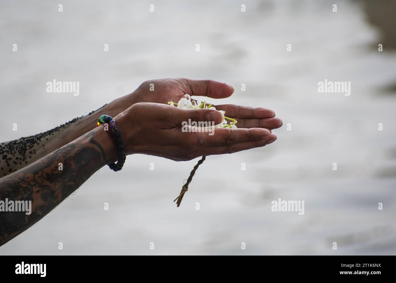 Hindu devotees perform the 'Tarpan' ritual during Mahalaya prayers ...
